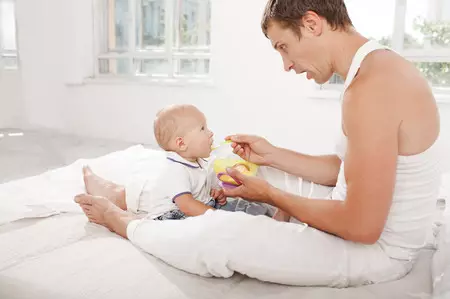 Dad Feeding Baby