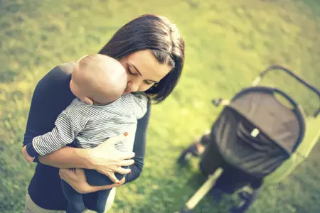 Mamm Hugging Baby