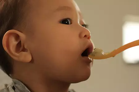 baby_eating_fish.jpg